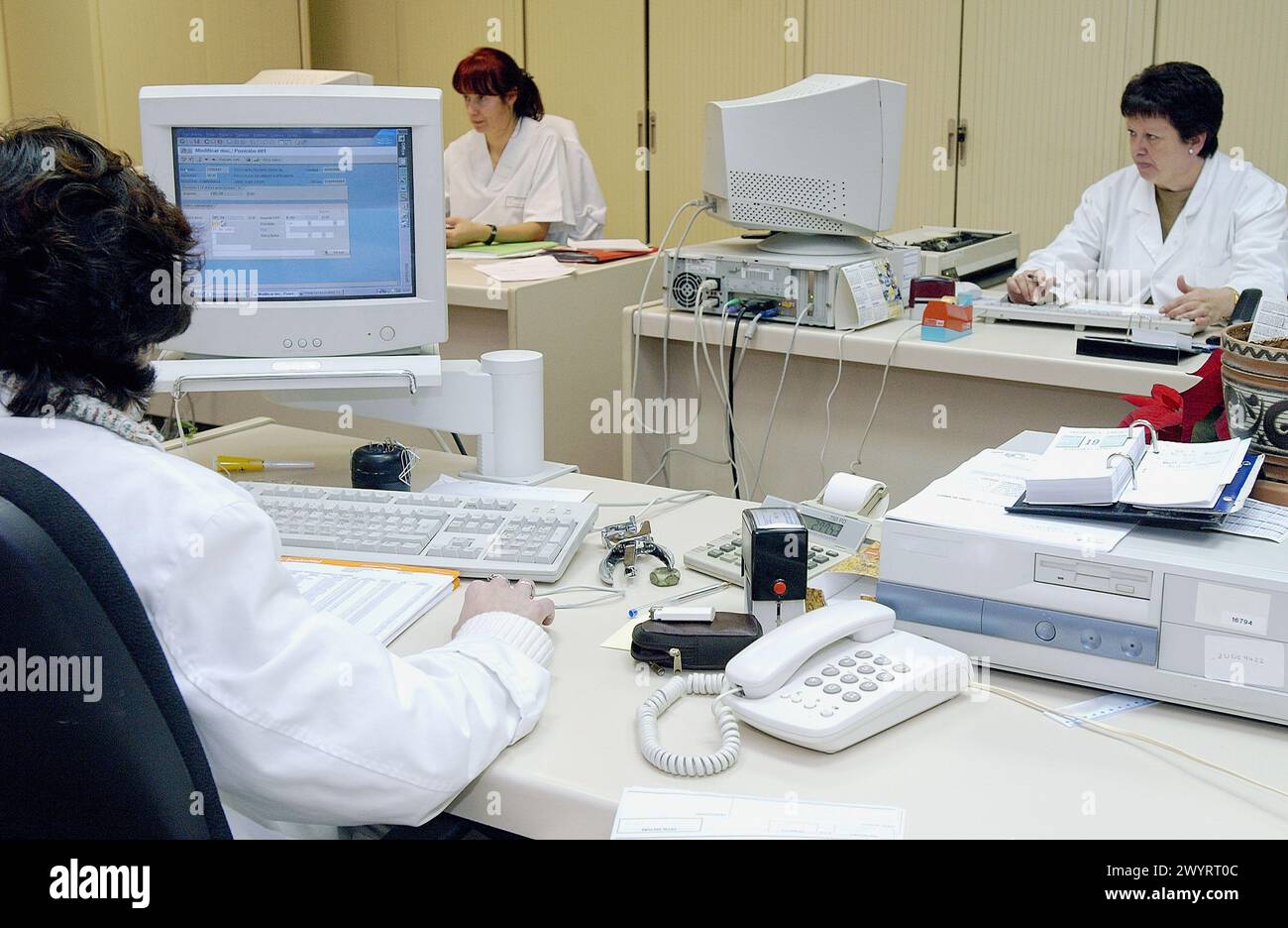 Employees working at administration offices of hospital Stock Photo - Alamy