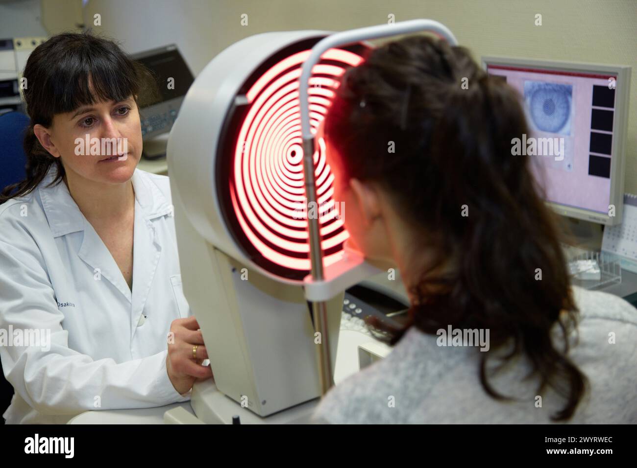 Eye examination Patient having a corneal topography measurement made of ...