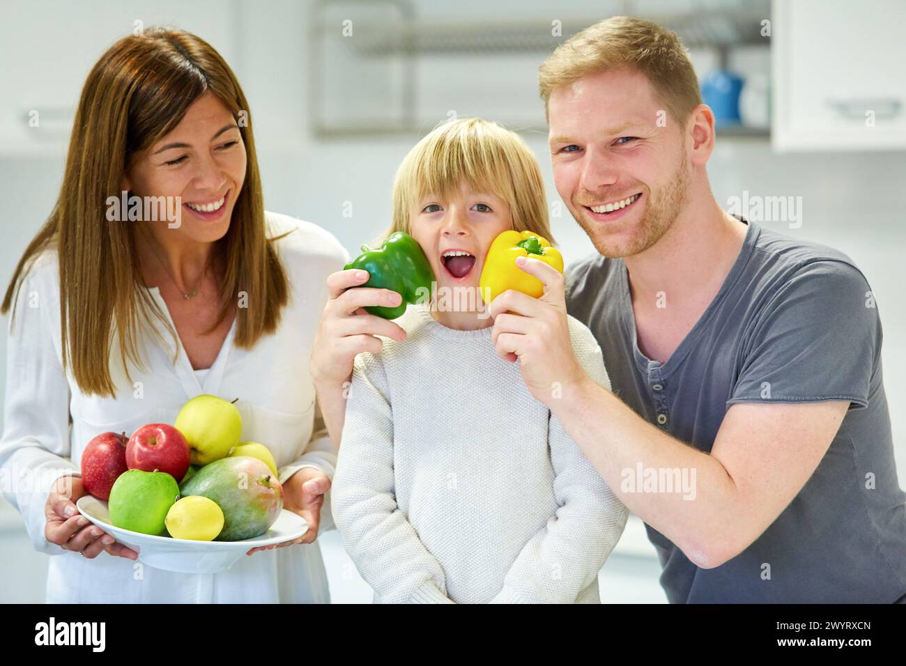 Family in the kitchen. Parents and son. Healthy eating. Healthy growth ...