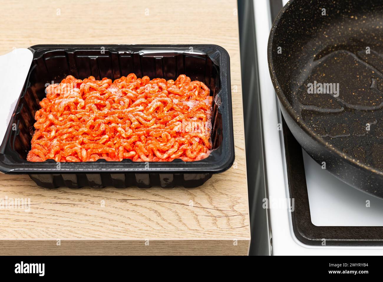 packaging with minced meat in the kitchen. chopped meat. raw minced ...