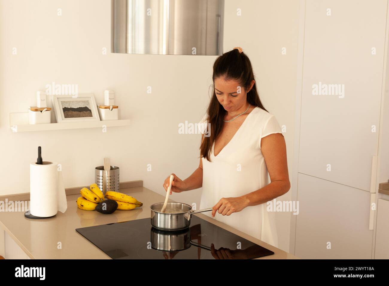 Housewife cooking in kitchen food Stock Photo - Alamy