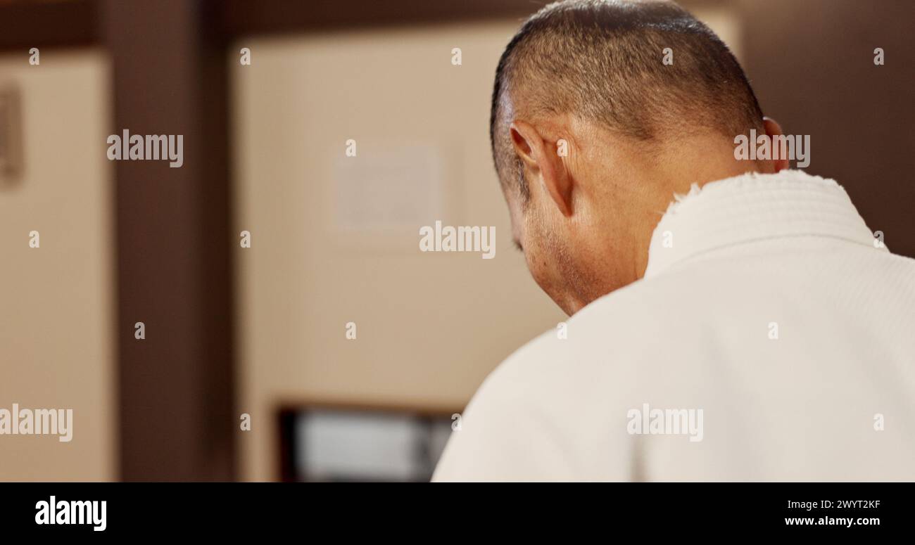 Aikido, student and man bow in respect for martial arts, class or ...