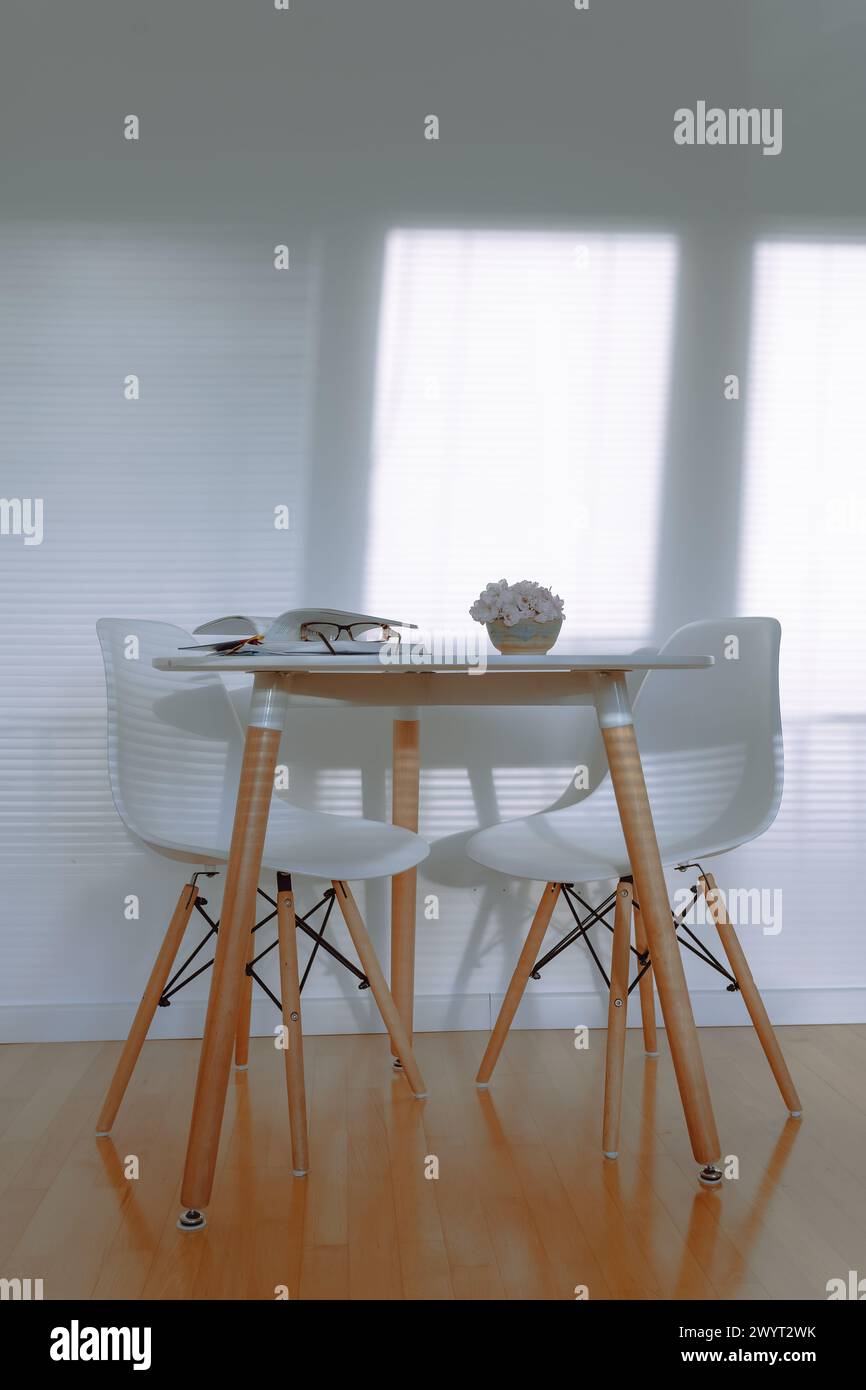 round table in interior with parquet floor and white wall Stock Photo ...