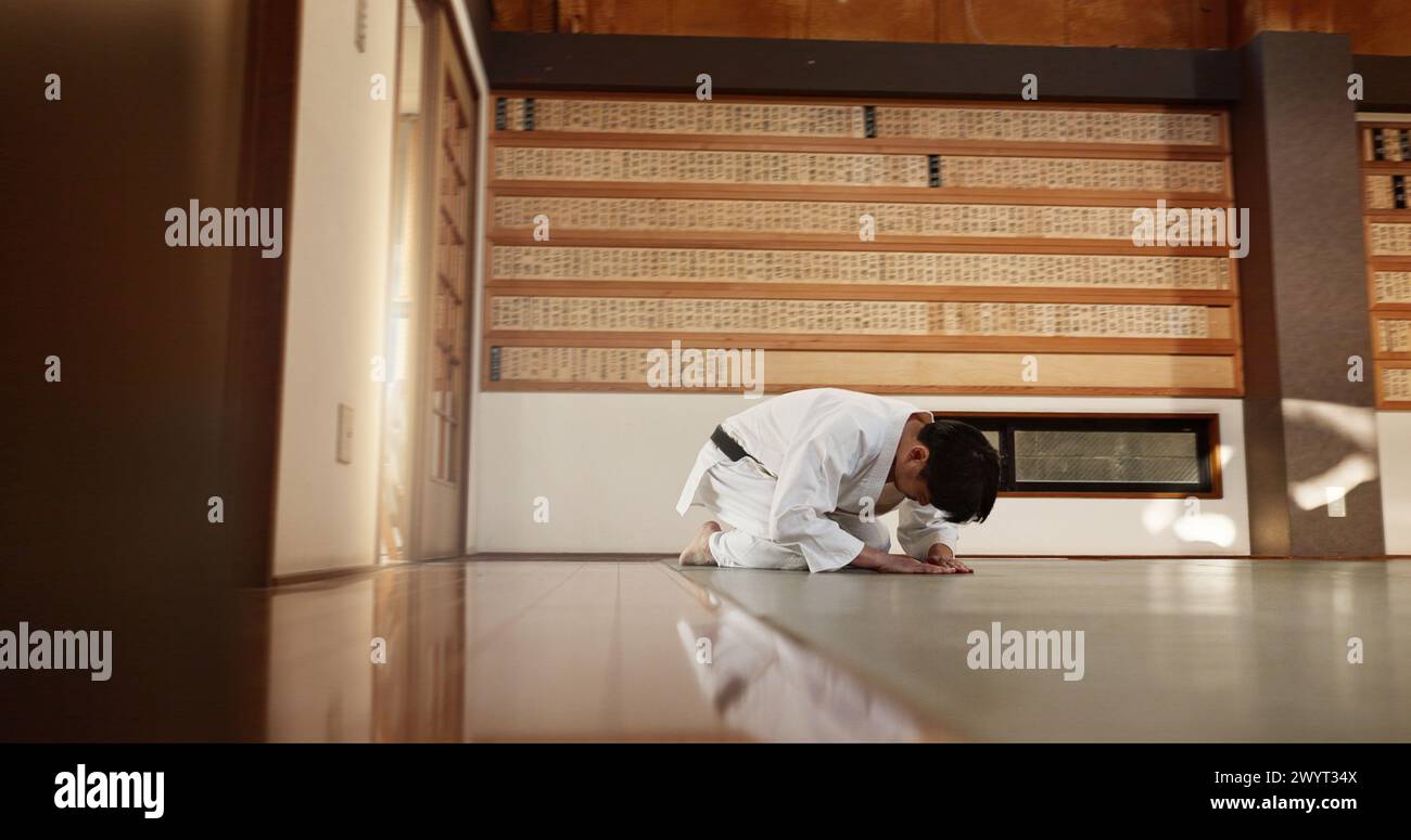 Japanese student, bow or man in dojo to start aikido practice ...