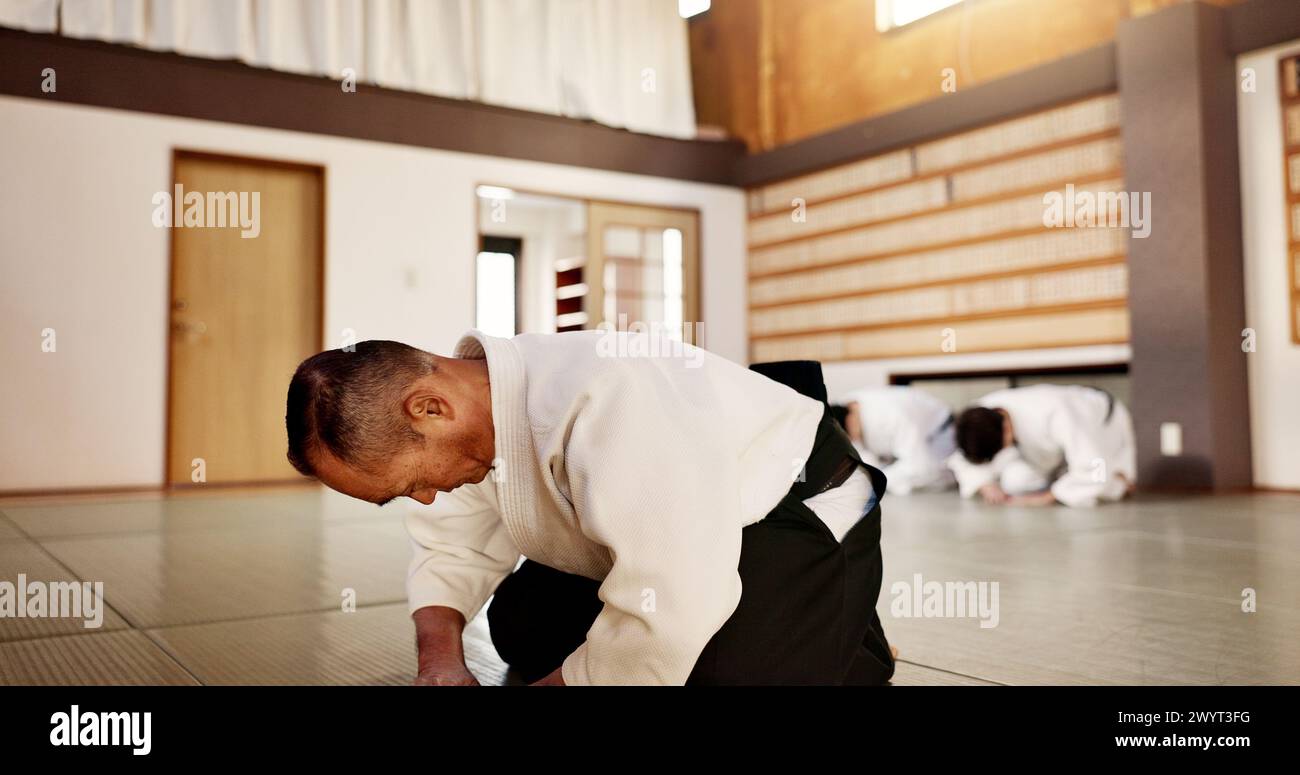 Aikido class, sensei and students with bow, martial arts or respect for ...