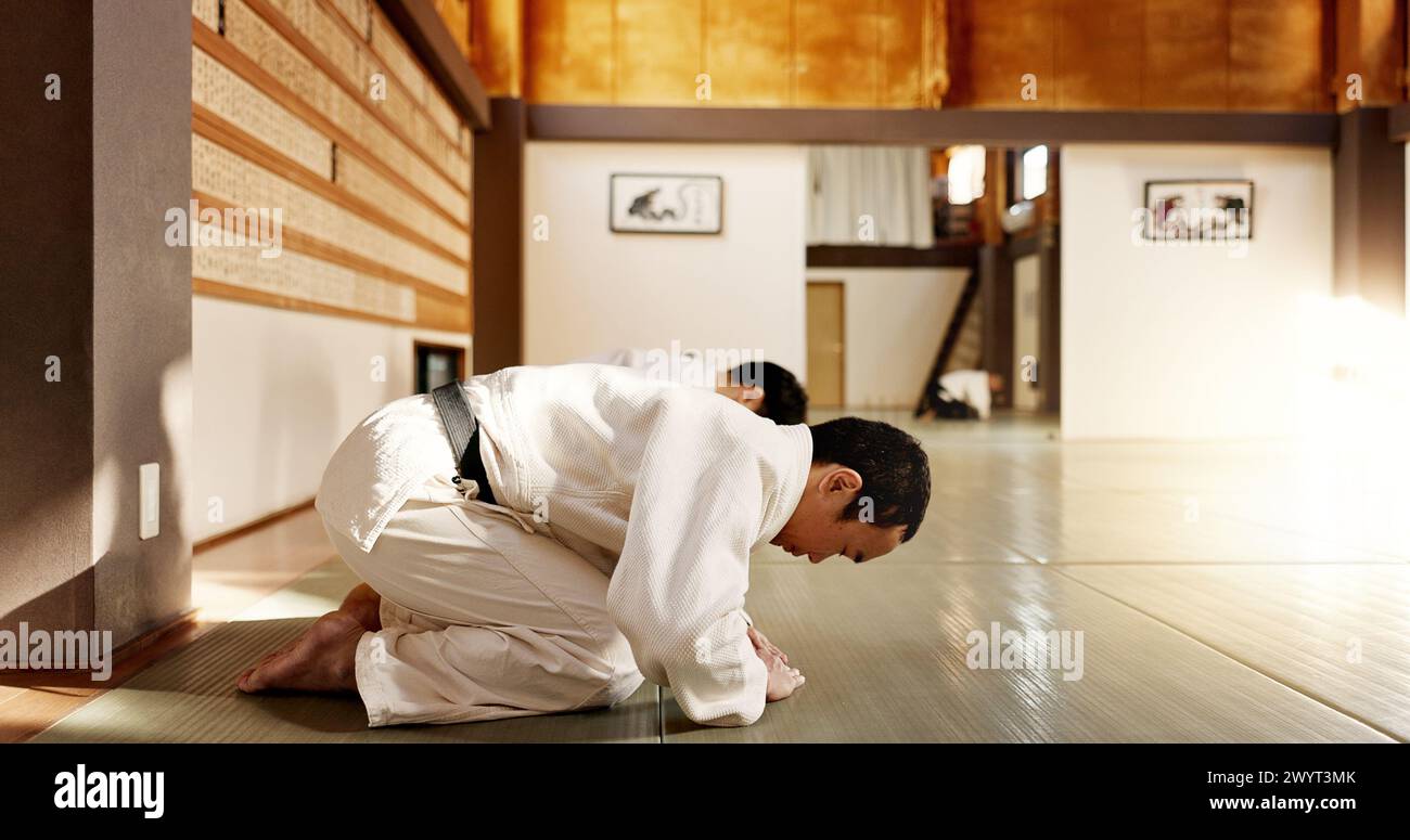 Japanese student, bow or men in dojo to start aikido practice ...