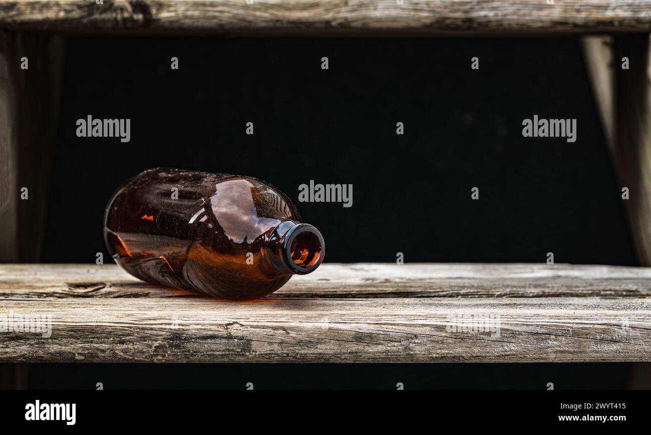 Stubby beer bottle on rustic wooden steps Stock Photo - Alamy