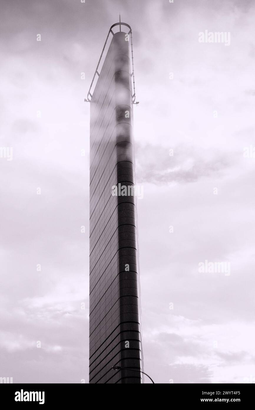 Exhaust tower, tall, thin and narrow metal clad structure. Looking up ...