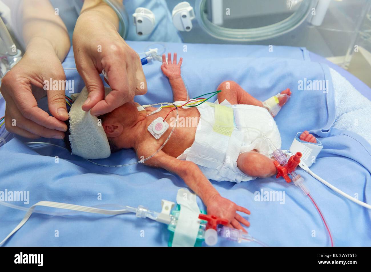 Baby icu nurse hands hi-res stock photography and images - Alamy