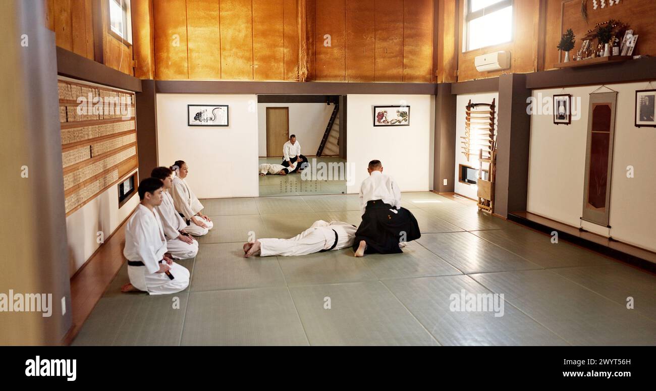 Students, aikido sensei or teaching Japanese martial arts in dojo for ...