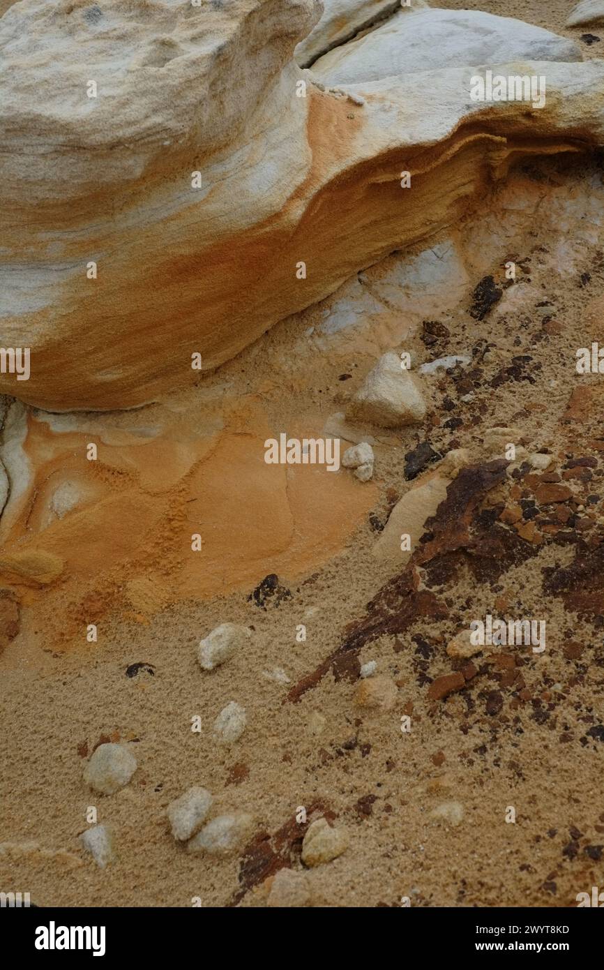 Soft weathered sandstone and sand at white yellow ochre and rust ...