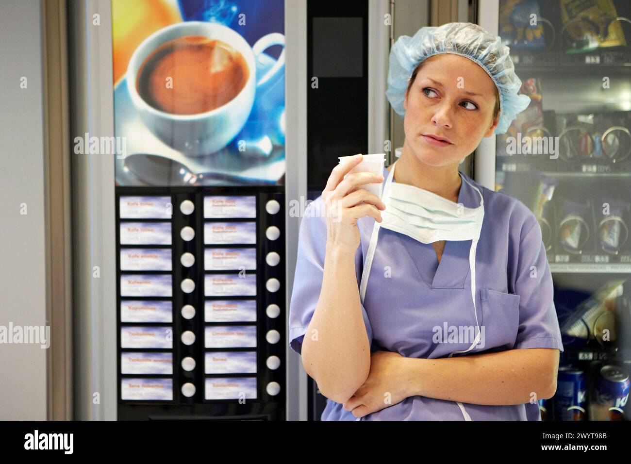 Surgeon taking a coffee in break room, surgical block. Hospital ...