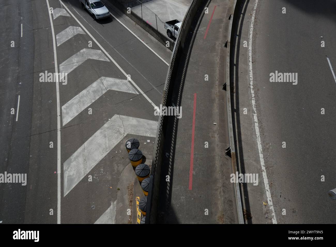 Looking down on the curve of an elevated road dissecting the wide mass ...