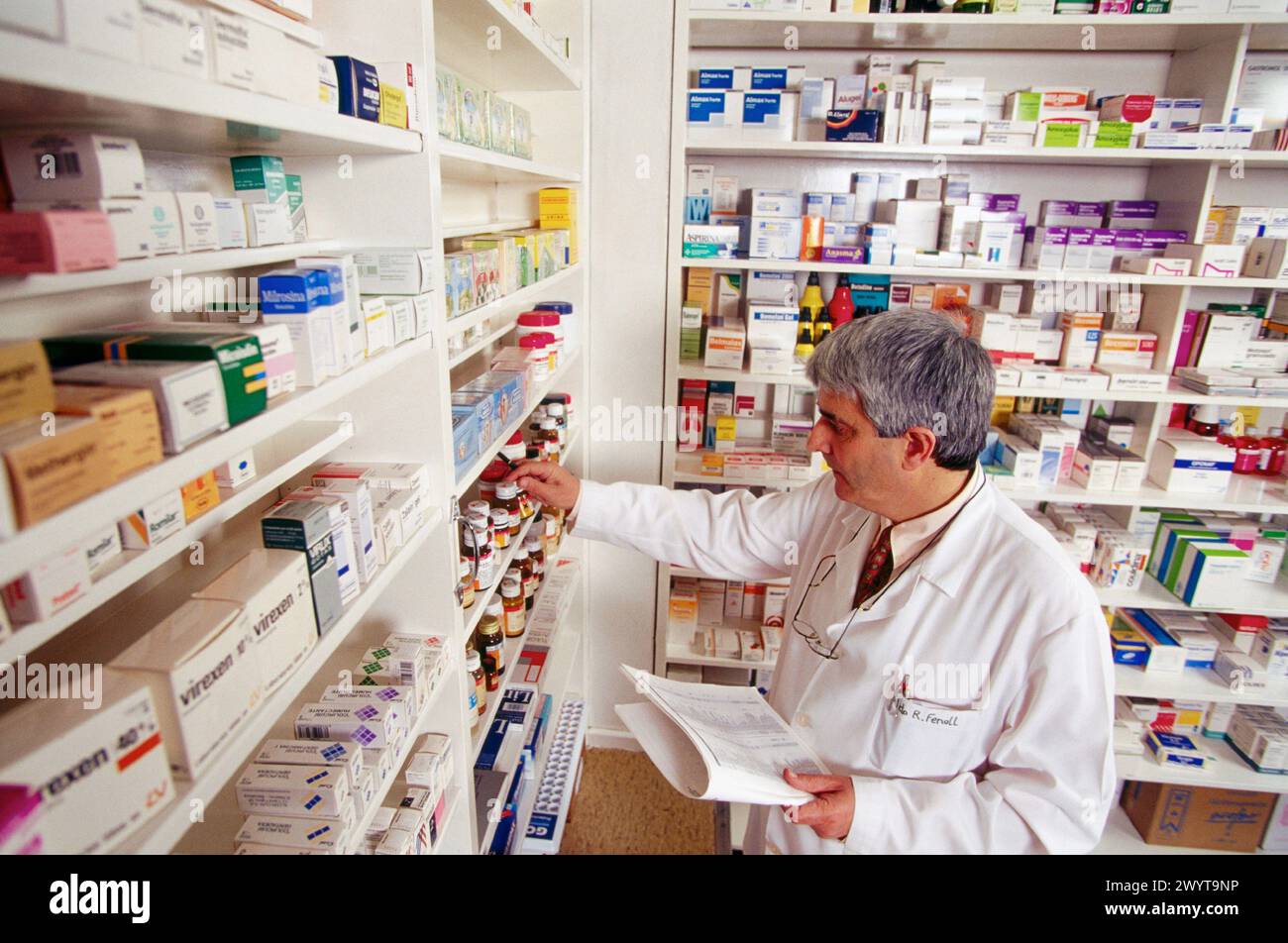 Pharmacy interior pharmacists working hi-res stock photography and ...