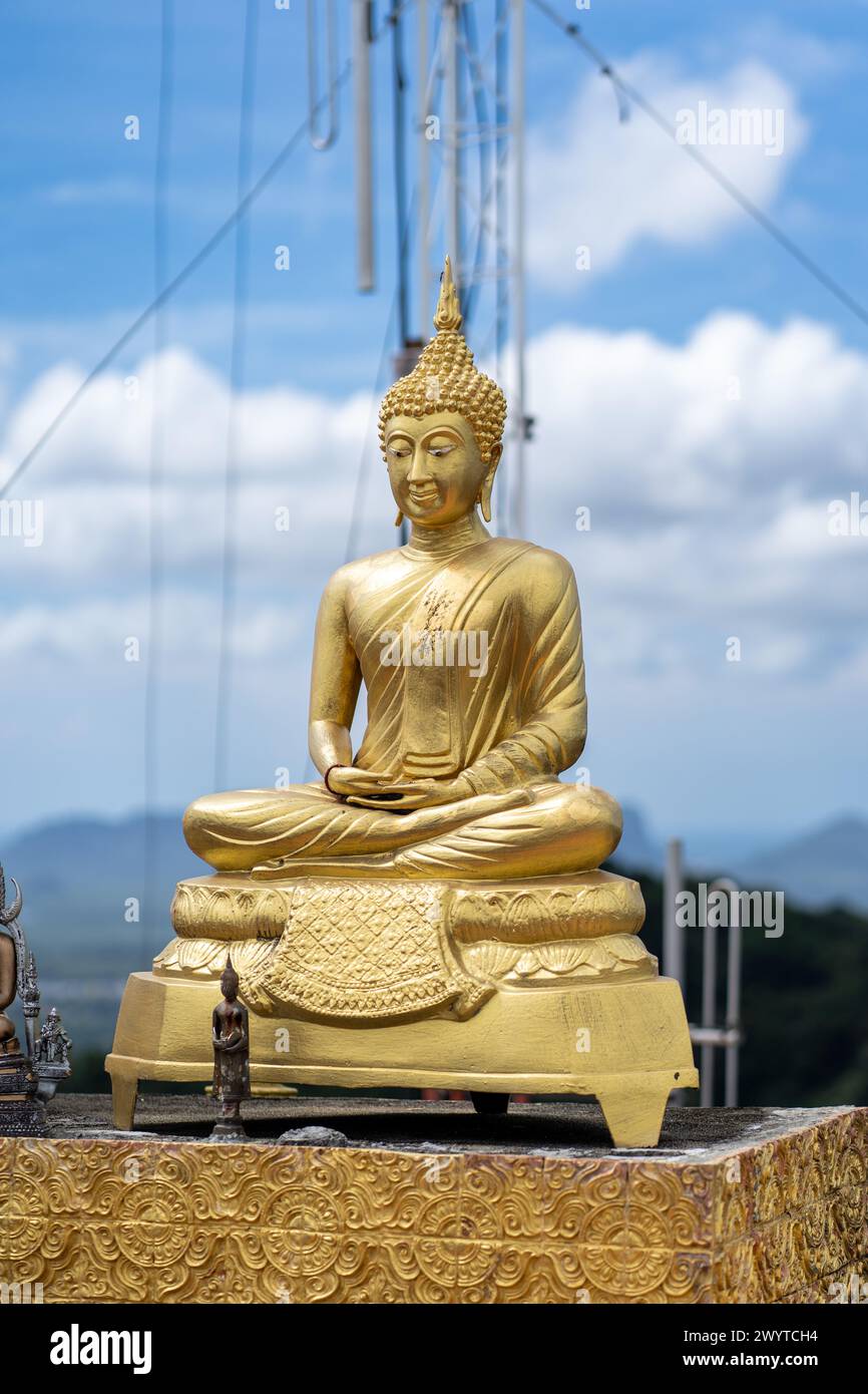 Large and small buddhist statues together at Tiger Cave Temple ...