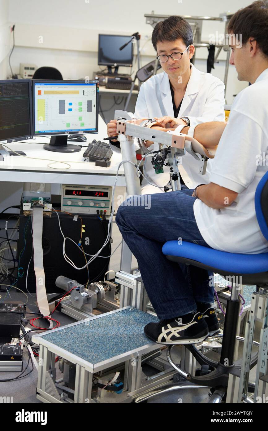 Researcher placing a patient clinical training device of the limb has ...