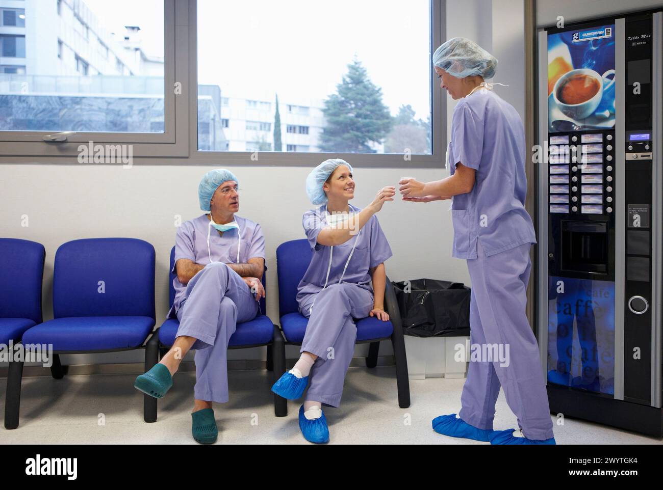 Surgeons taking a coffee in break room, surgical block. Hospital ...