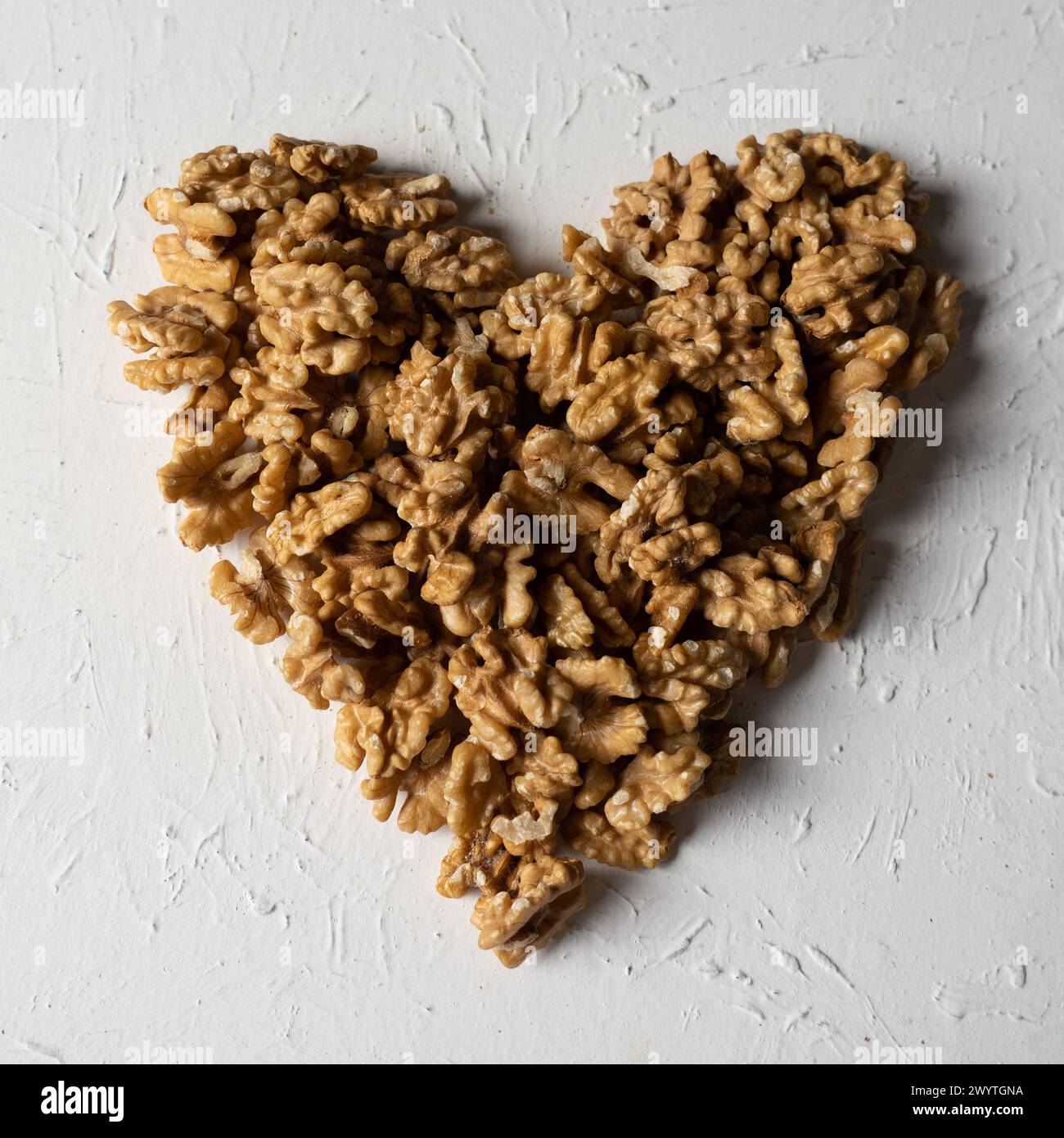 Nuts forming a heart shape isolated on white background. Top view Stock ...
