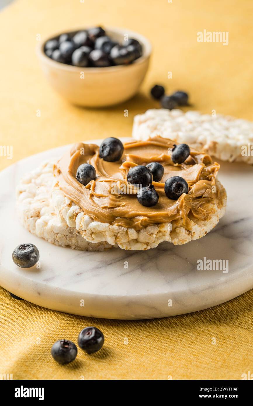 Peanut butter and rice cakes sandwich. Healthy protein snack Stock ...