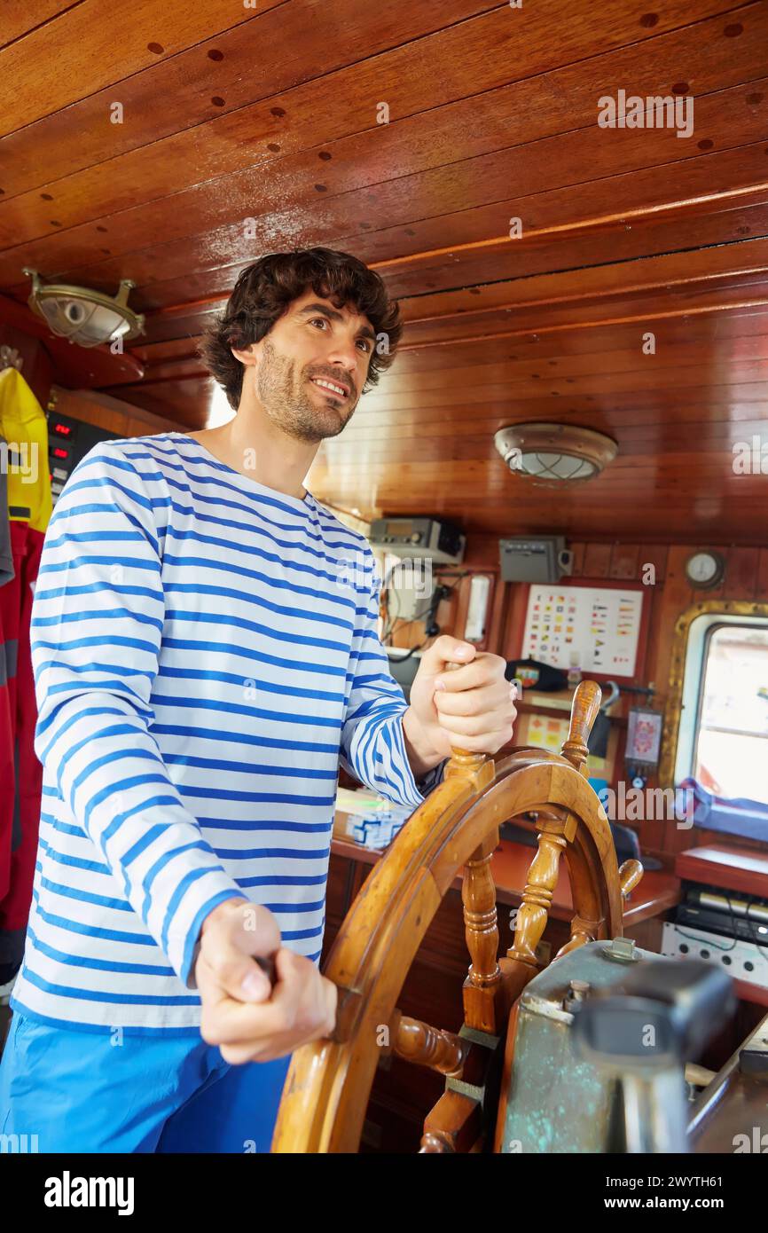 Sailor at the helm of a sailboat, galleon. Basque Country. Spain Stock ...