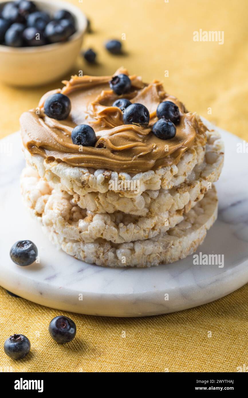 Peanut butter and rice cakes sandwich. Healthy protein snack Stock ...