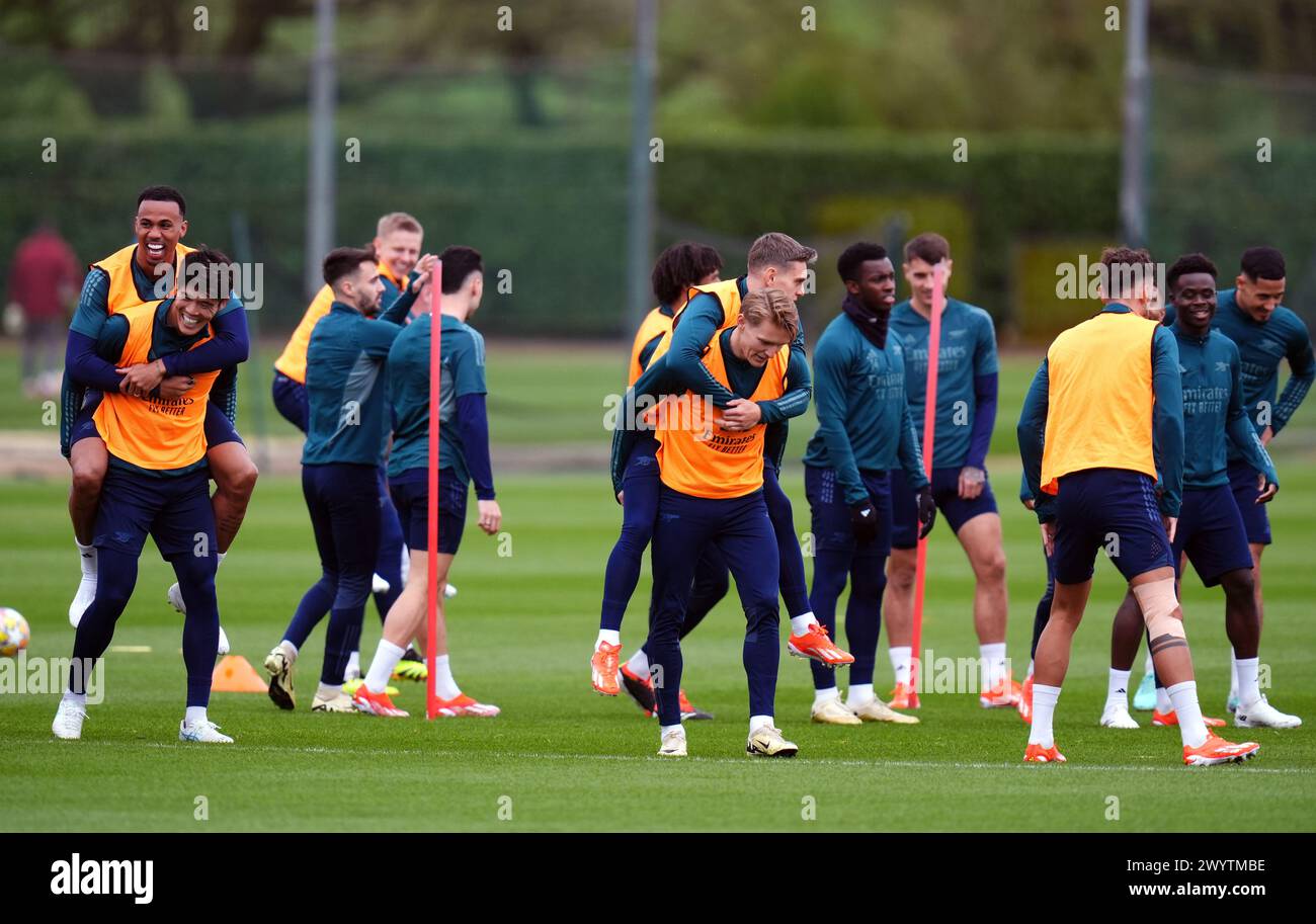 Arsenal's Martin Odegaard (centre) and Leandro Trossard during a ...