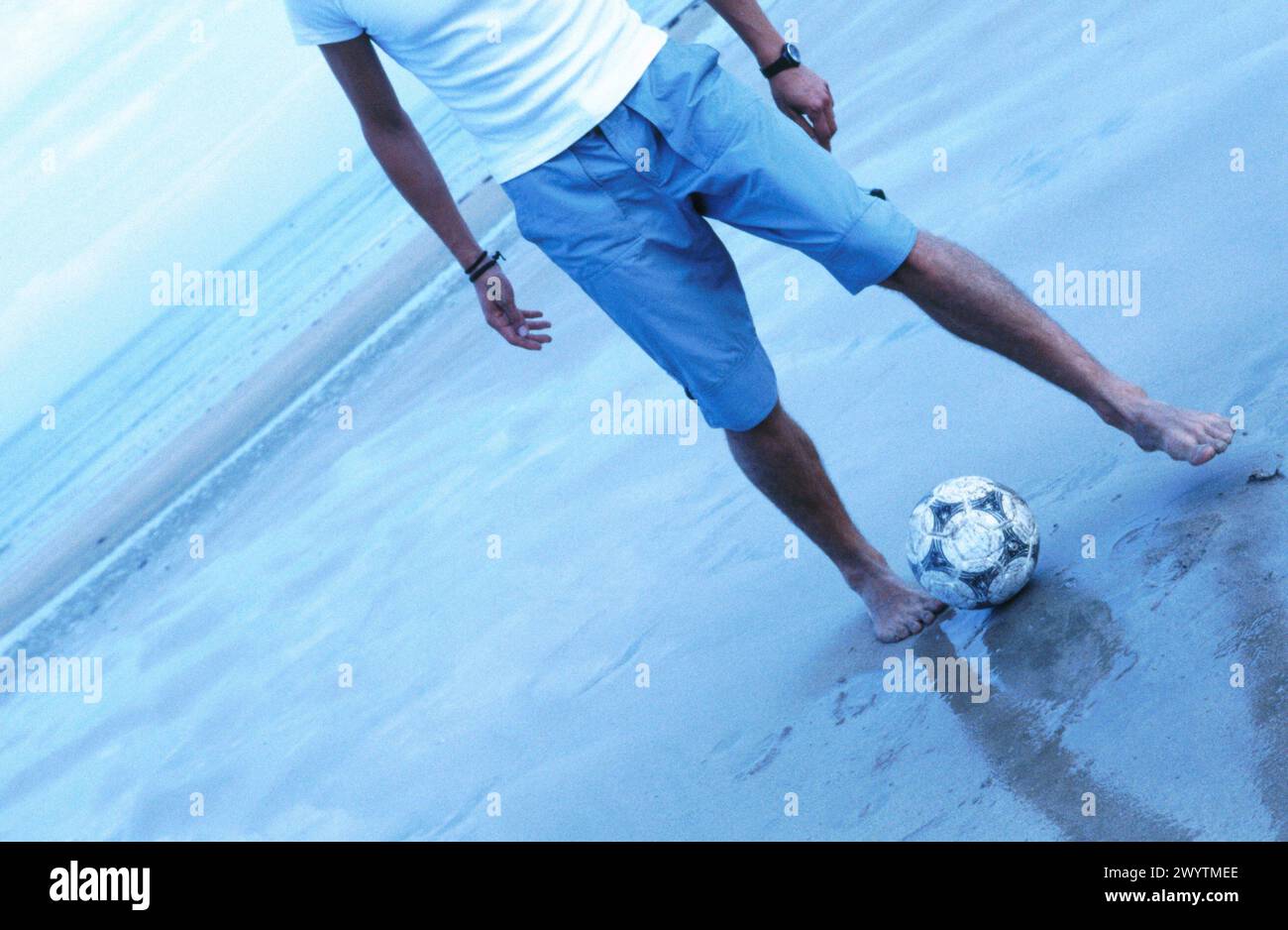 Boys playing soccer barefoot hi-res stock photography and images - Alamy