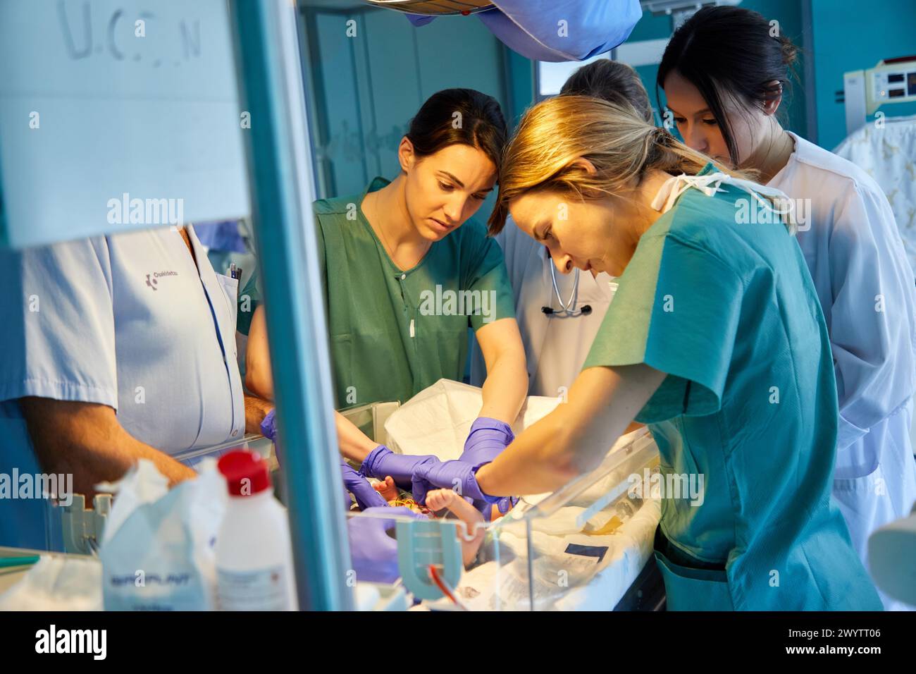 Team of doctors and nurses attending to a baby, Neonatal pediatrics ...