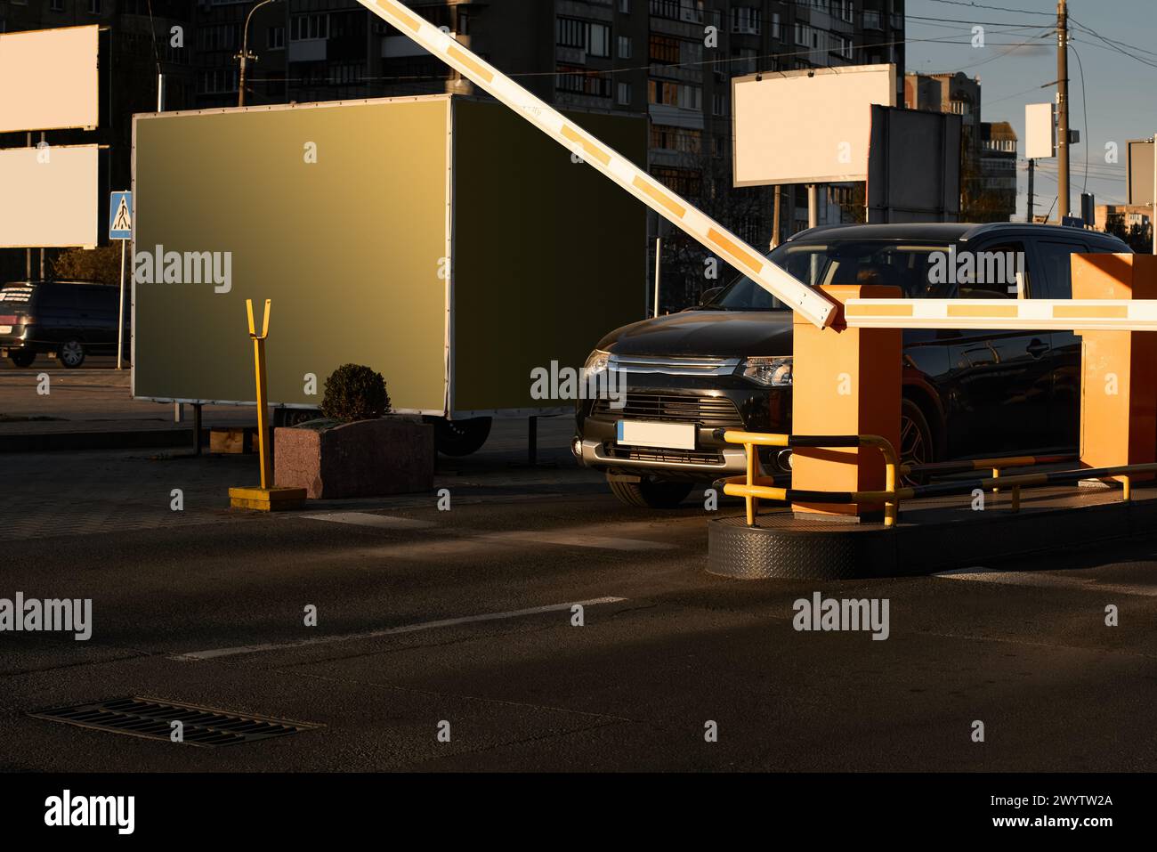 Car approaching to automatic barrier gates for supermarket parking lot ...