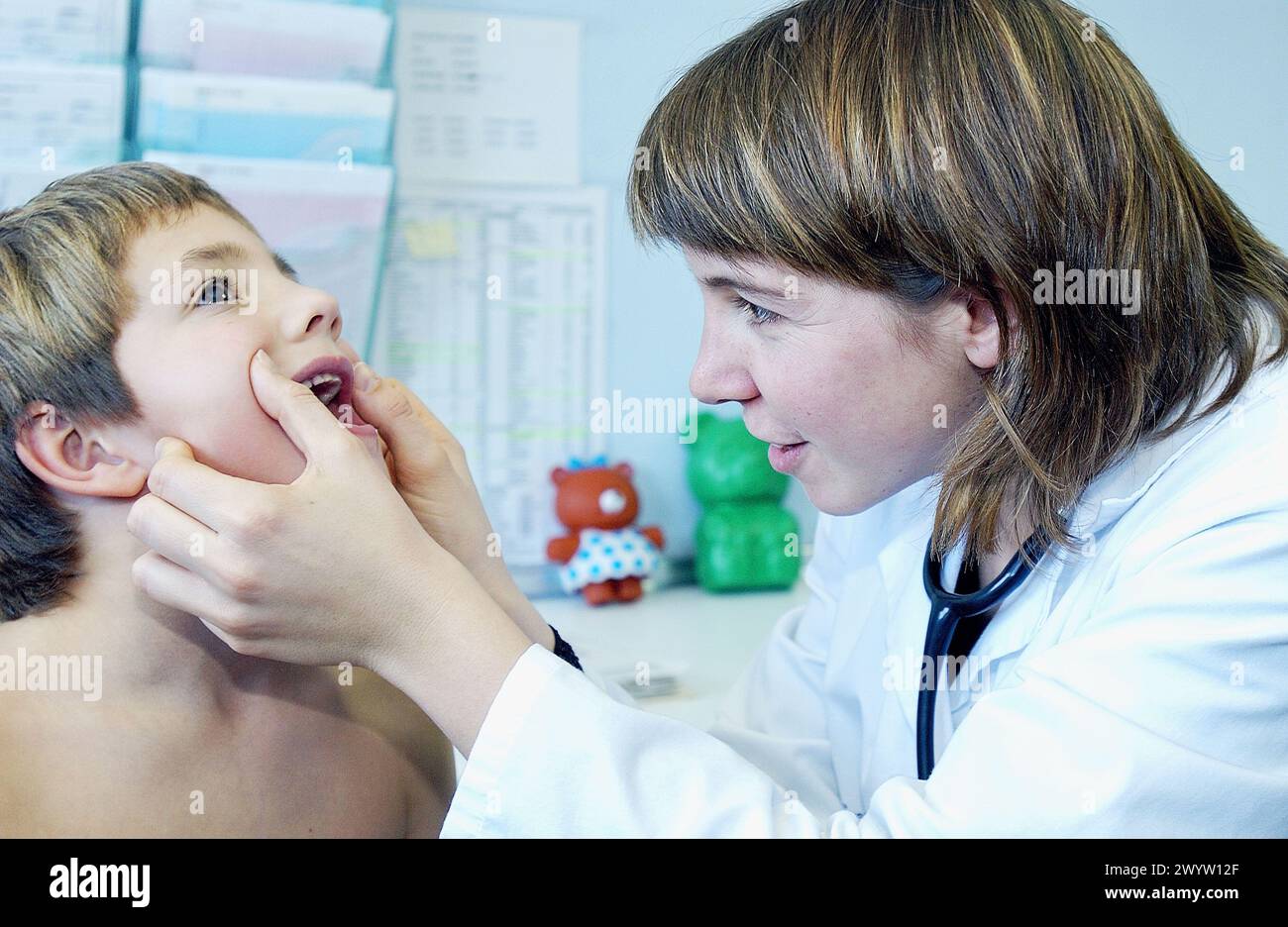 Pediatrician examinating 6 year old boy at pediatrics section of hospital Stock Photo - Alamy