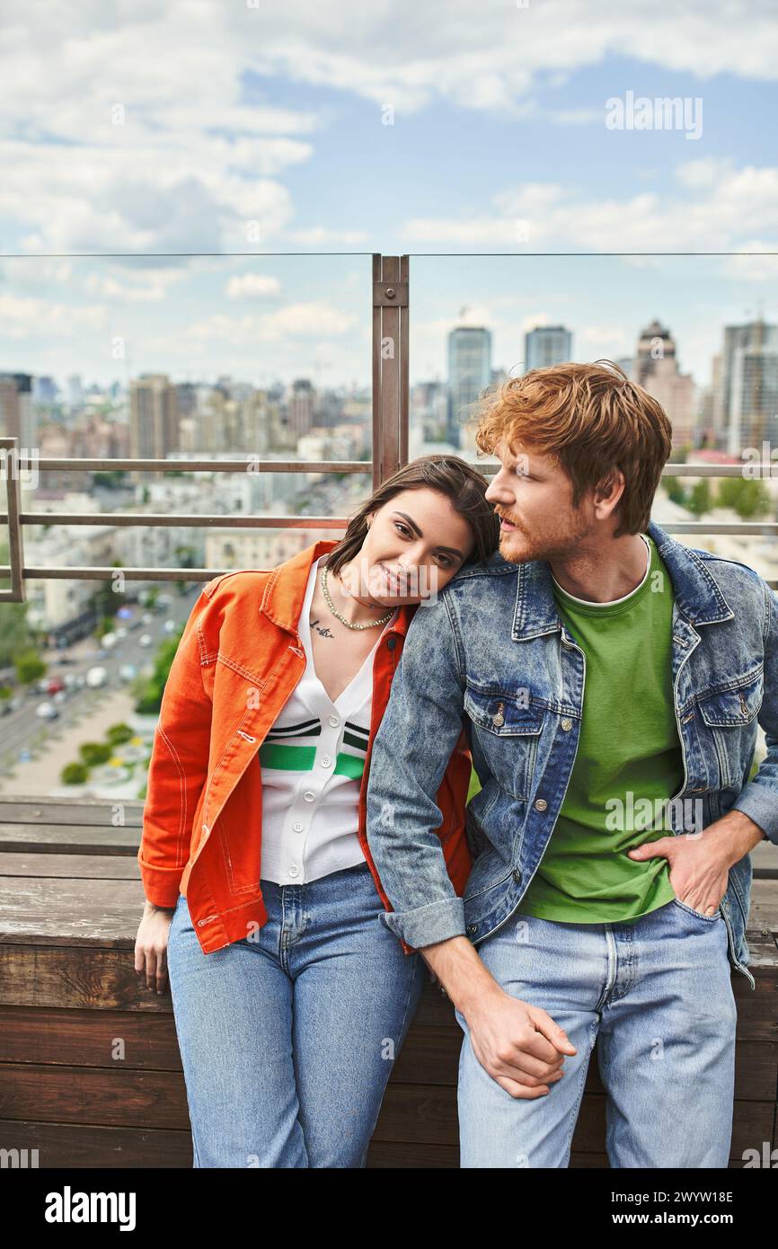 A man and a woman standing closely together, their body language ...