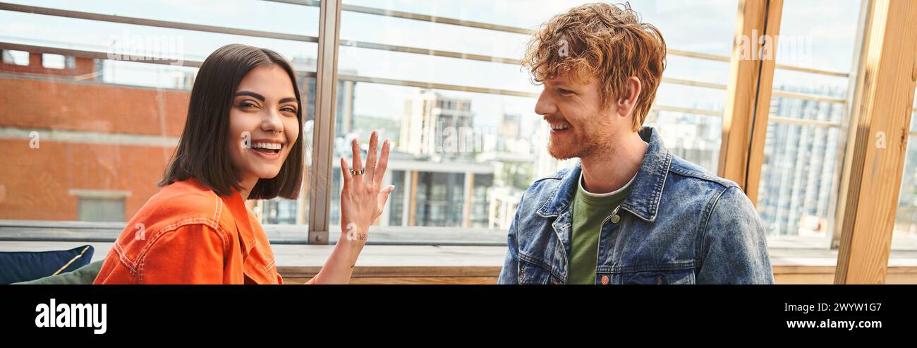 A man and a woman stand side by side, exuding a sense of unity and ...