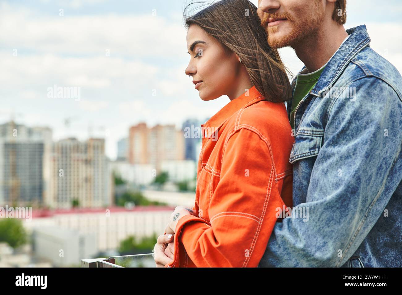 A man and a woman stand side by side, exuding a sense of unity and ...