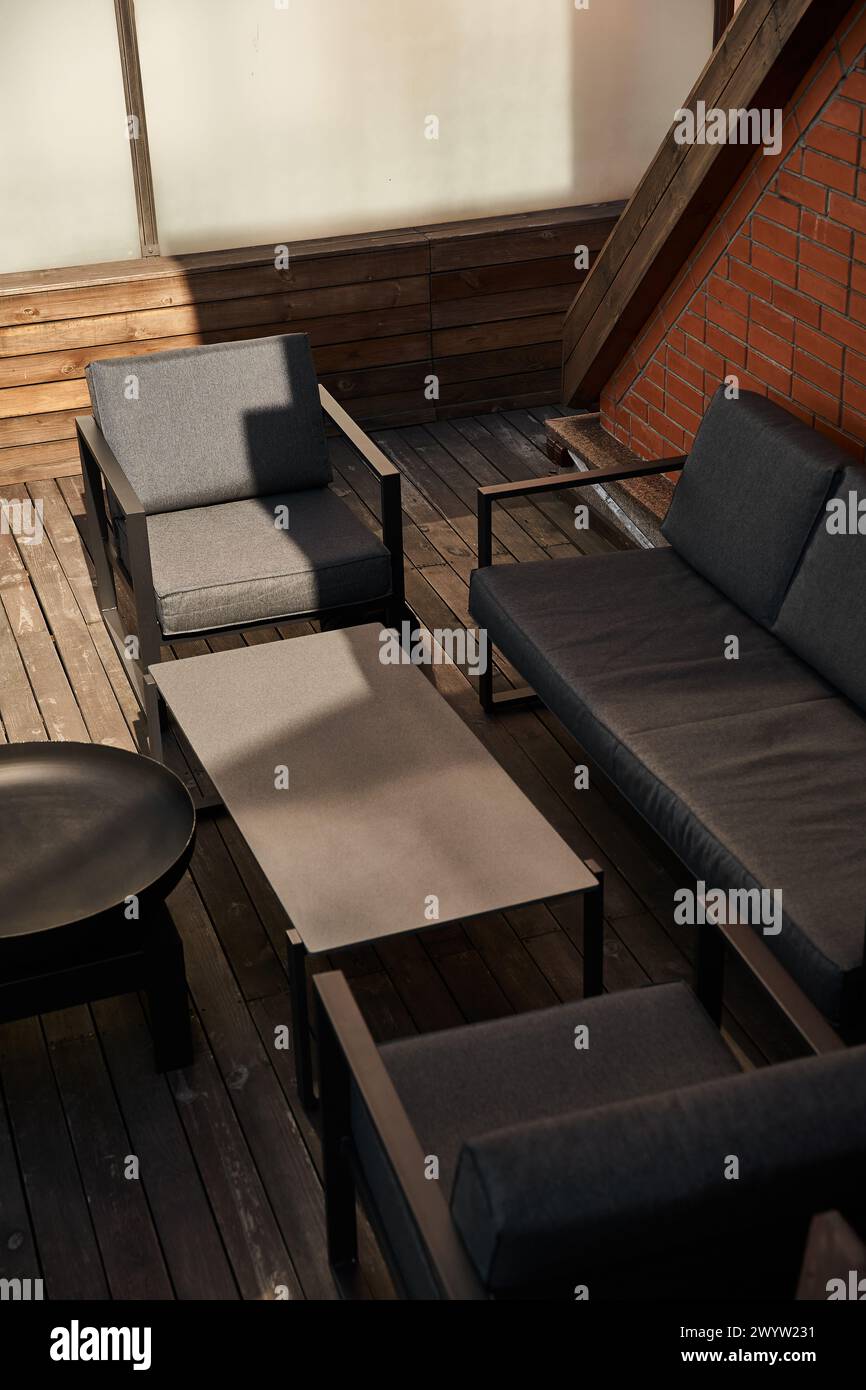 A room filled with stylish furniture, centered around a warm fireplace ...