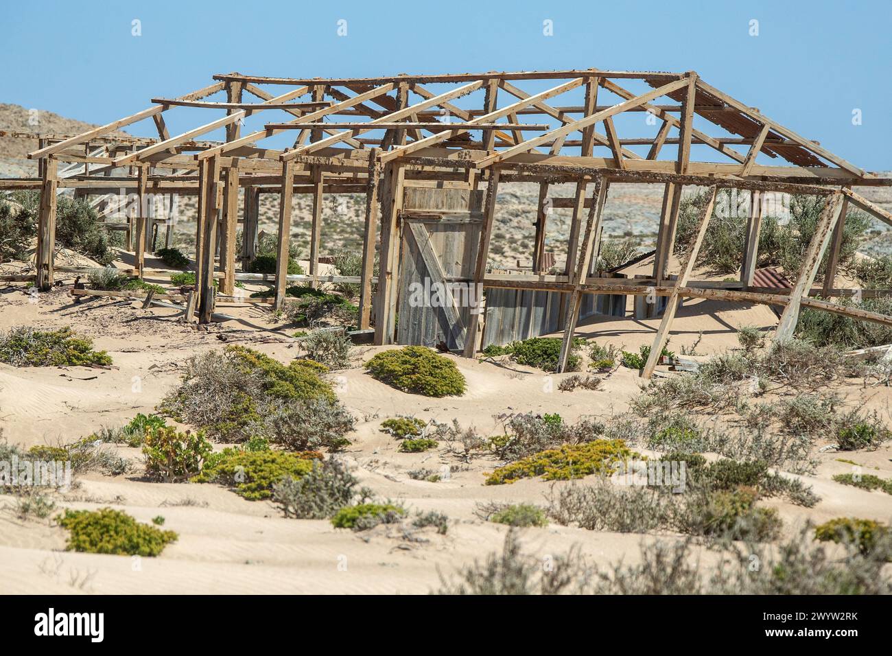 The timber frame of an abandoned, miner's house, out in the desert ...
