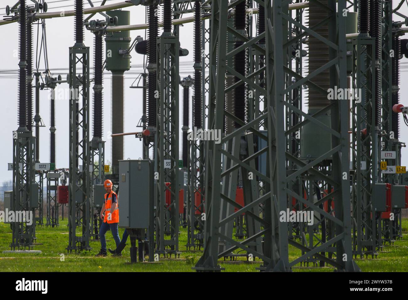 Wolmirstedt, Germany. 08th Apr, 2024. A "50 Hertz" employee walks ...