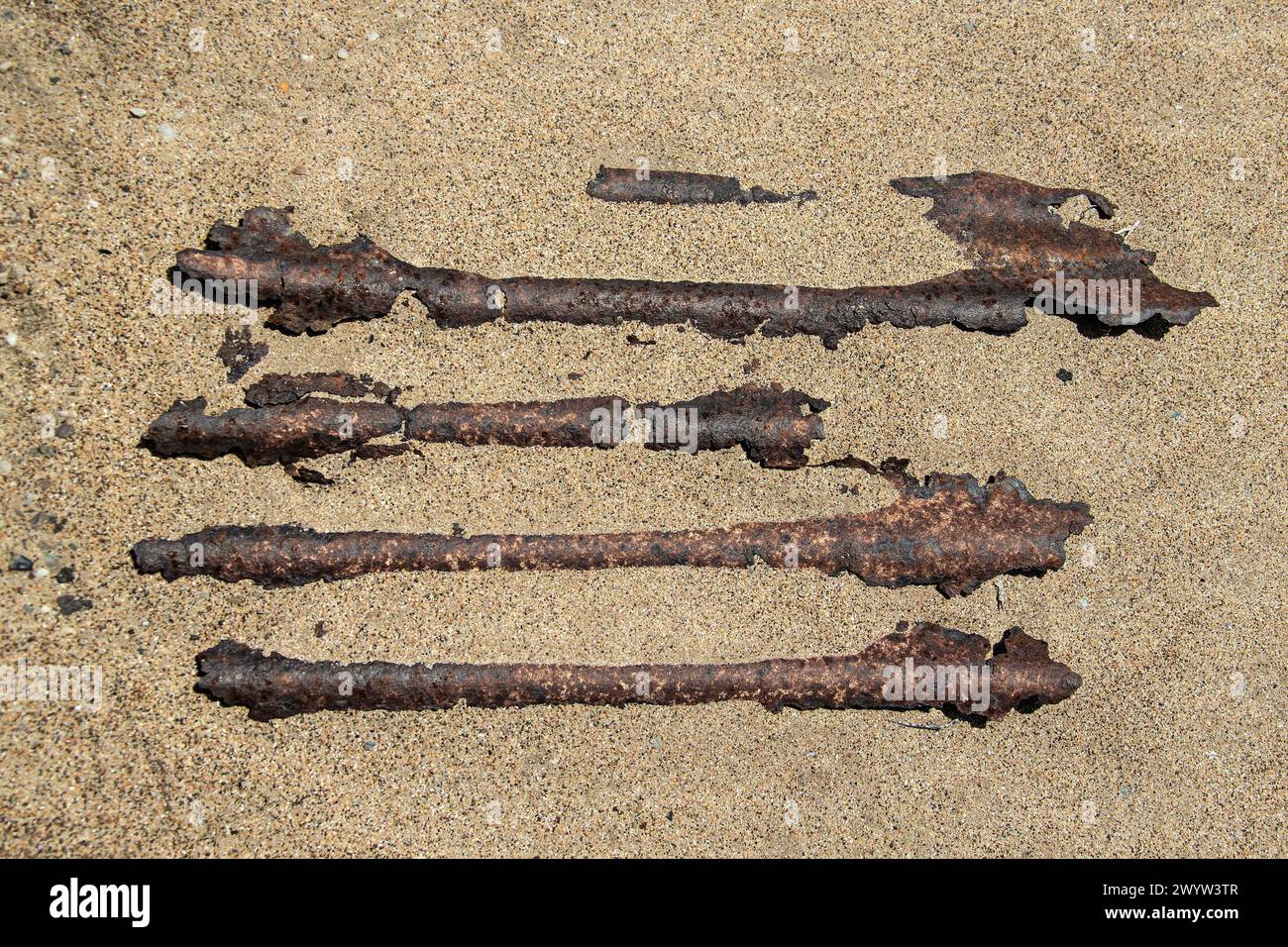 Half buried and rusting currugated iron panel, the metal remains of ...