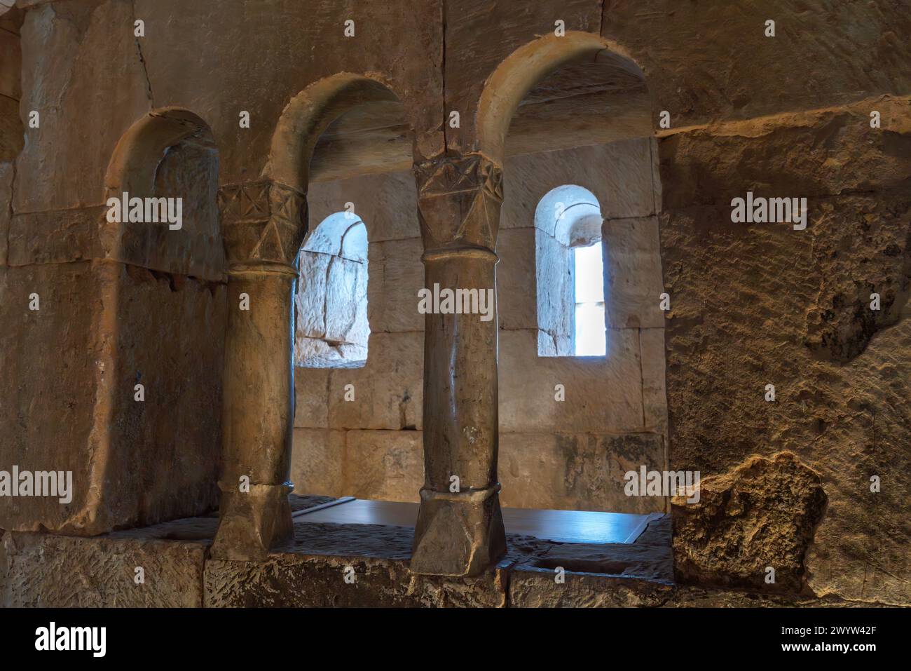 Triple keyhole window inside the Visigothic church of St. Peter of the ...