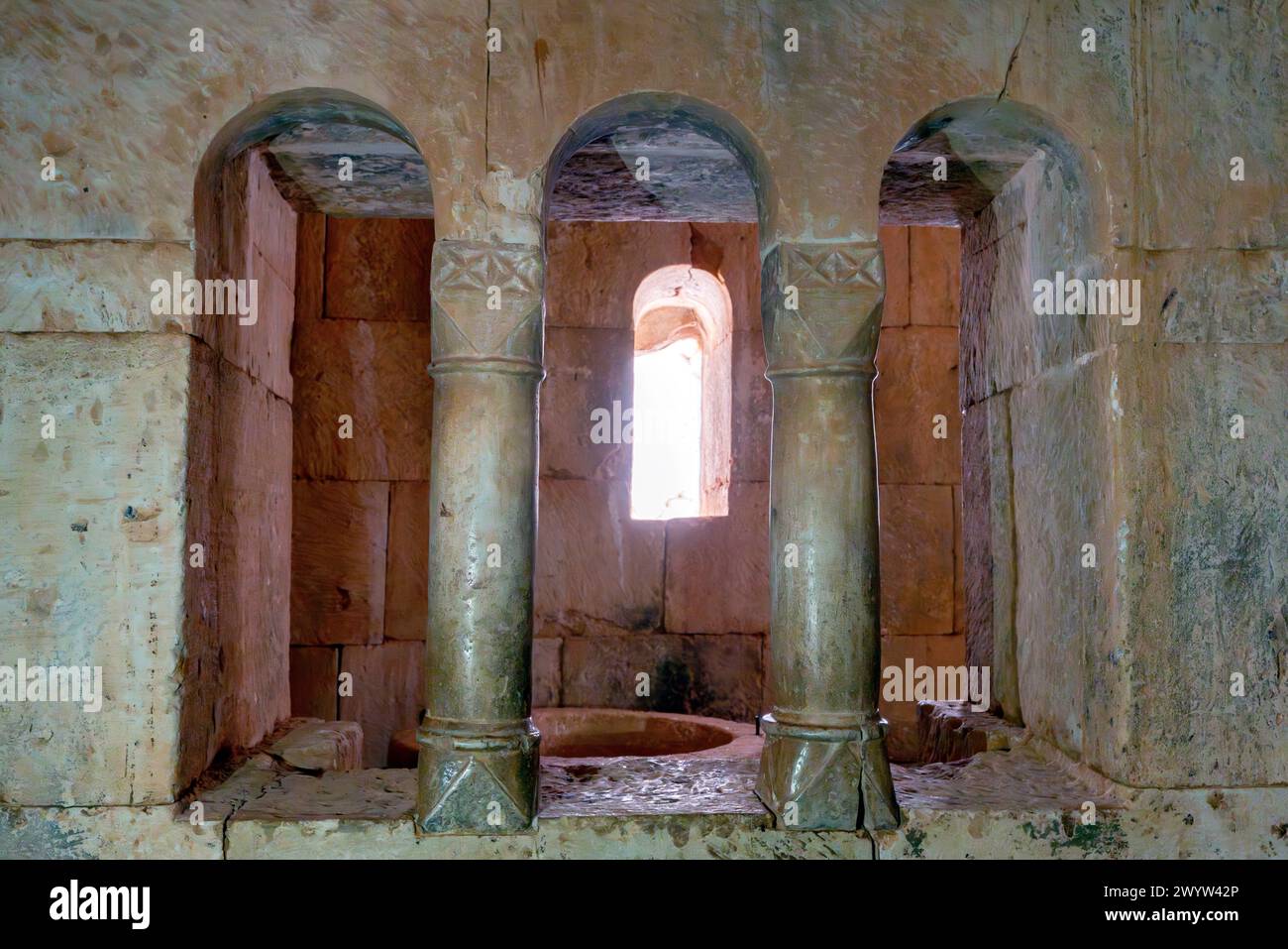 Triple keyhole window inside the Visigothic church of St. Peter of the ...