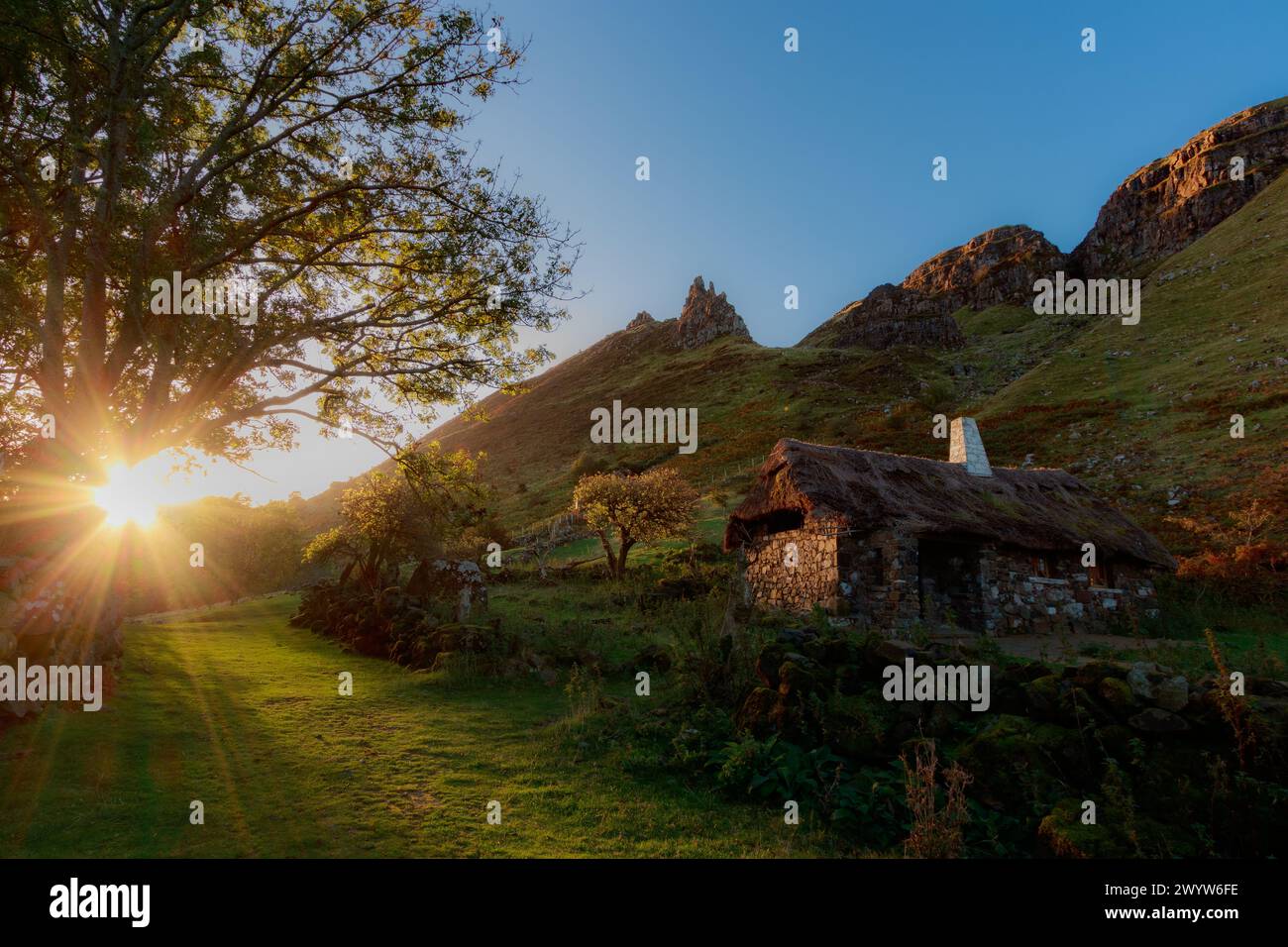 Traditional old irish house on mountain view of the sky on sunrise ...