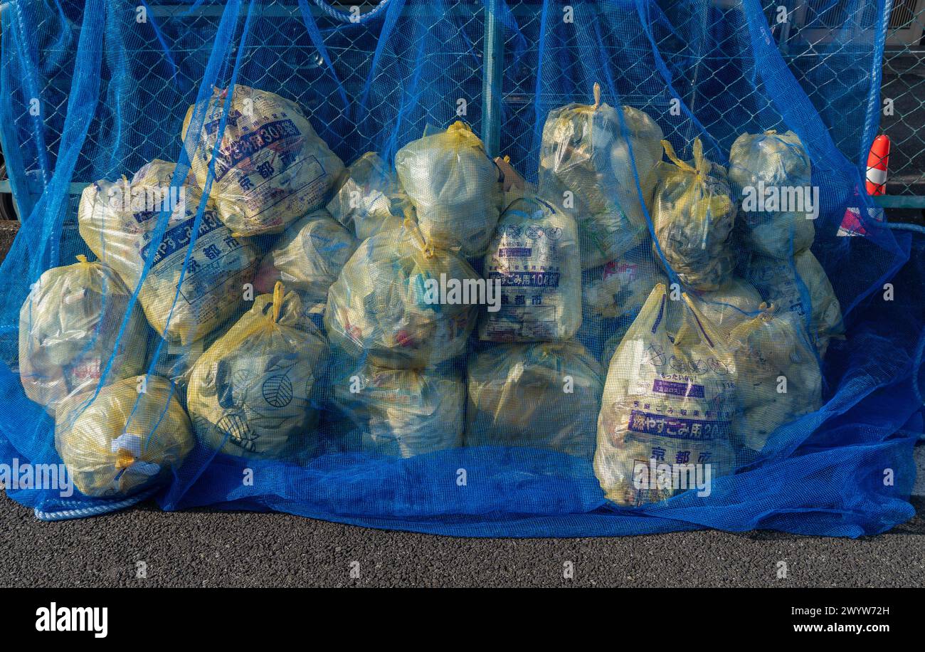 Waste disposal bags in a neighbourhood in Kyoto,Japan Stock Photo - Alamy