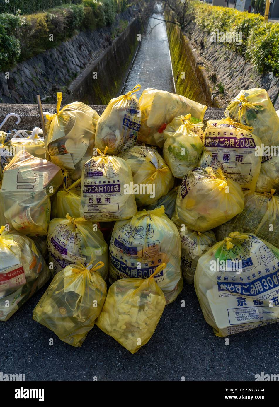 Waste disposal bags in a neighbourhood in Kyoto,Japan Stock Photo - Alamy