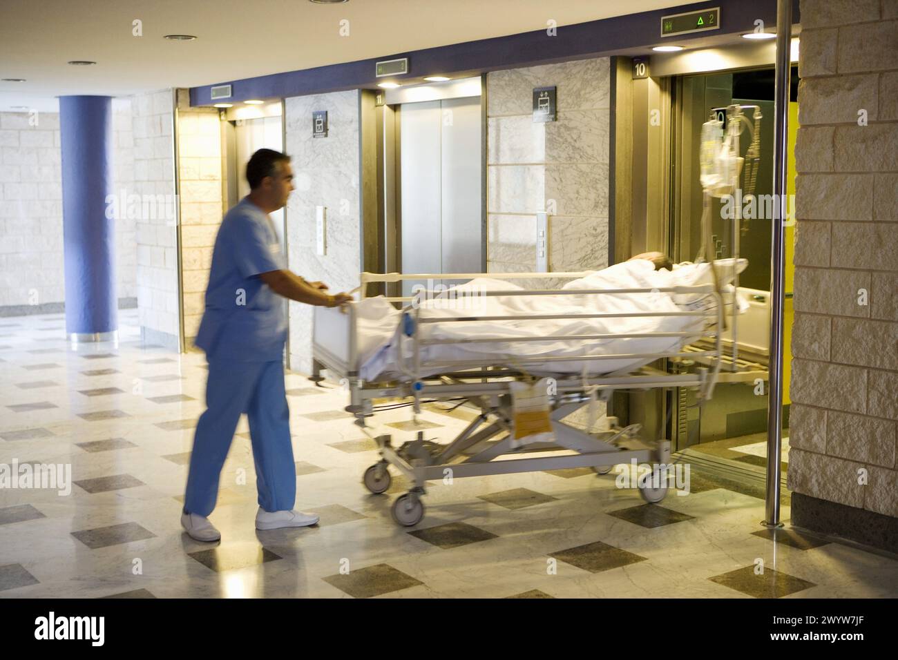 Hospital, Health moving patient on a stretcher, lift Stock Photo - Alamy