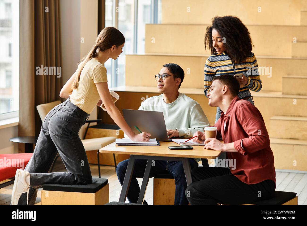 A diverse group of students from different backgrounds conversing and ...