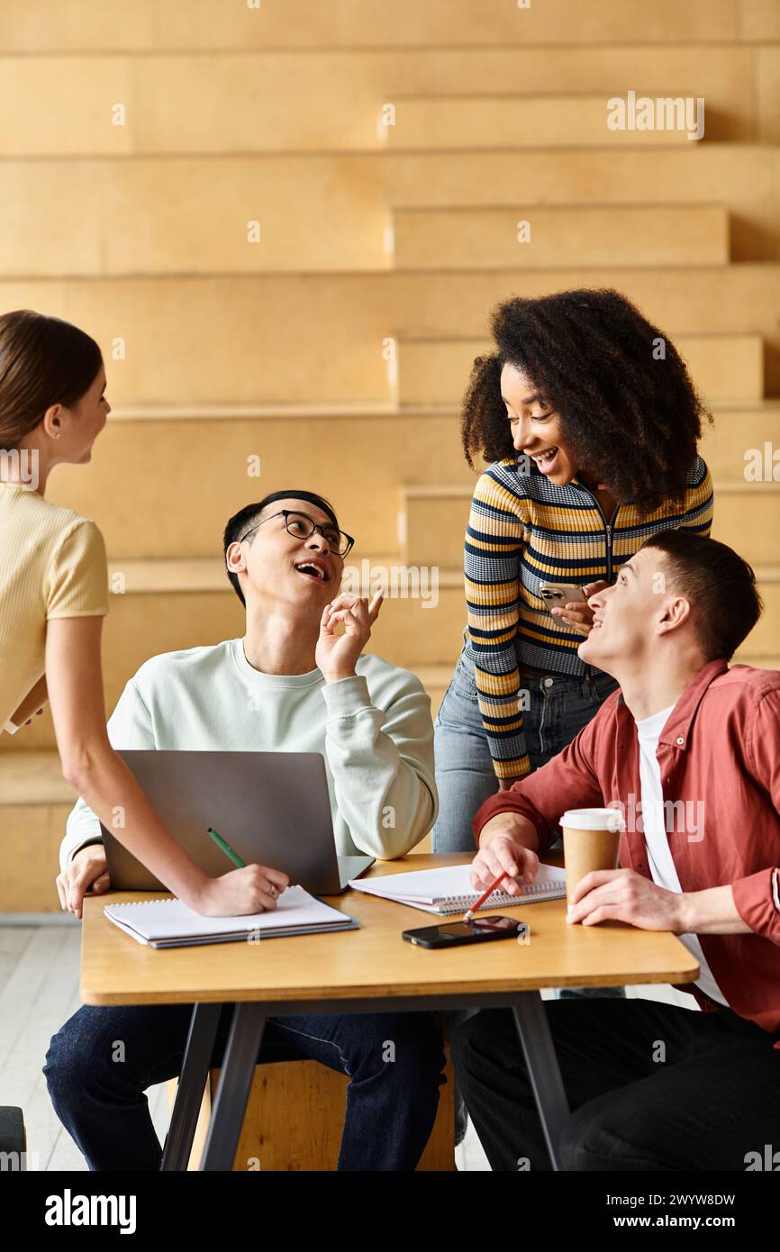 A multicultural group of students sitting around a wooden table in an ...