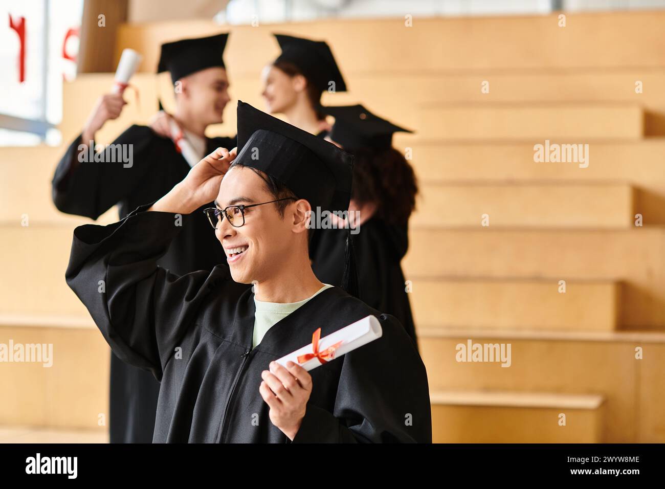 Diverse group students celebrates graduation hi-res stock photography ...