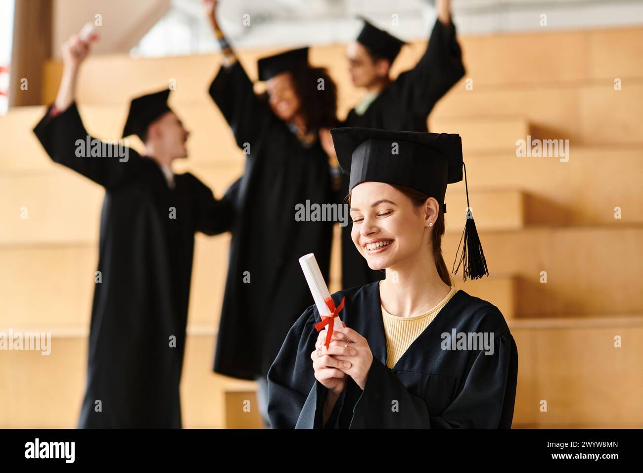 A diverse group of graduates celebrating achievement, a woman in a ...