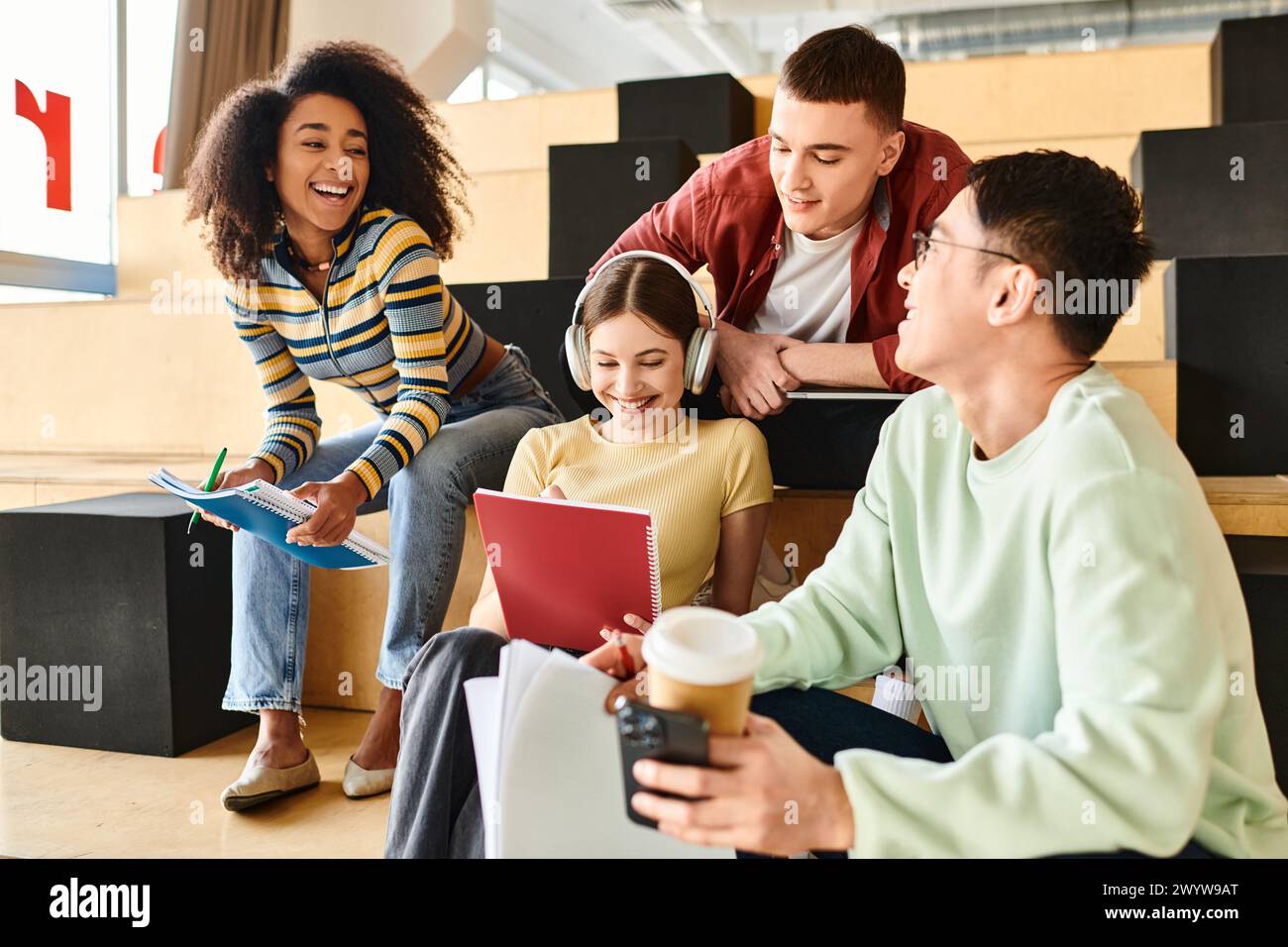 Various students from different backgrounds sitting closely, exchanging ...