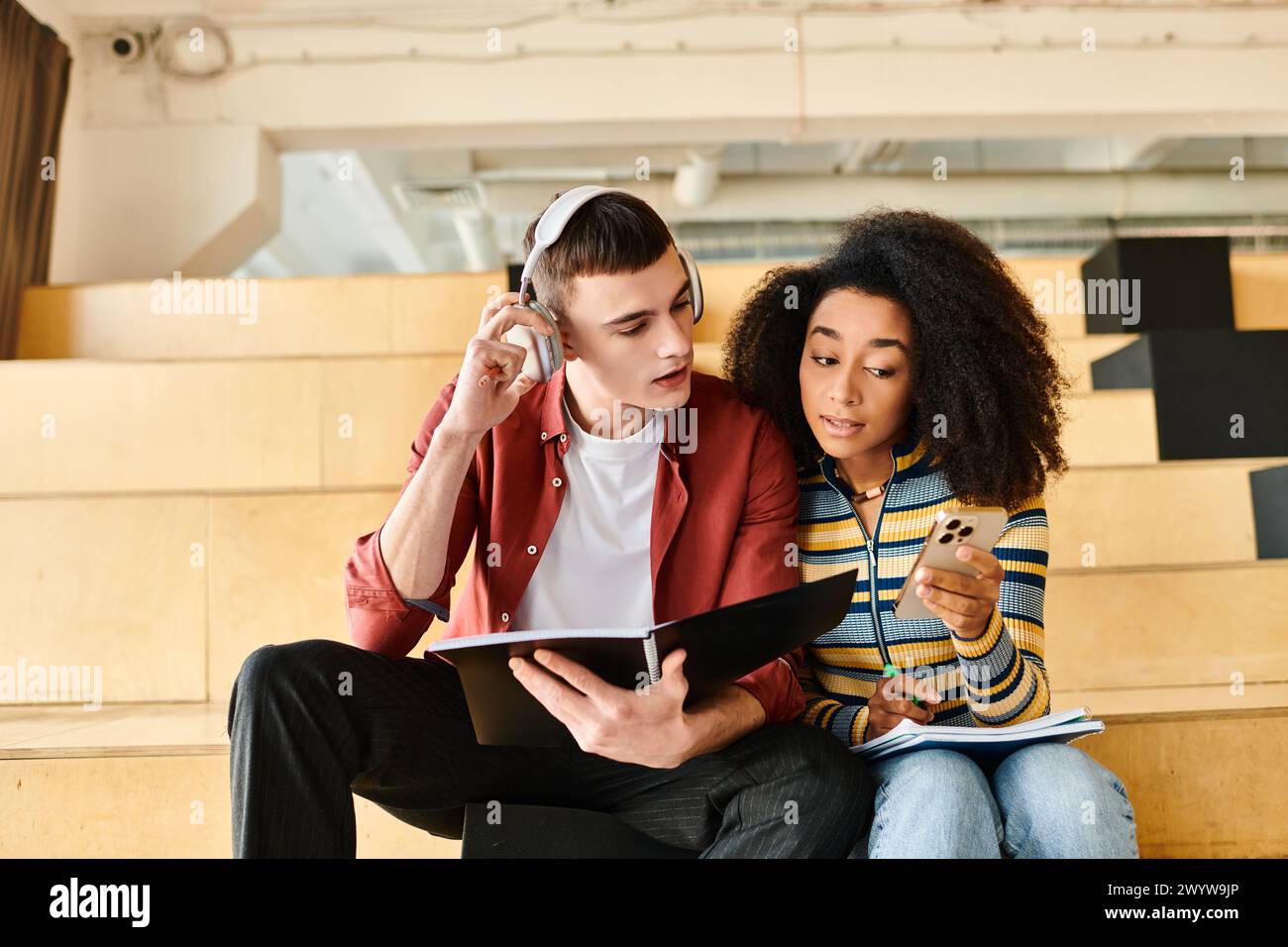 A man and woman, symbolizing multicultural cooperation, sit together on ...