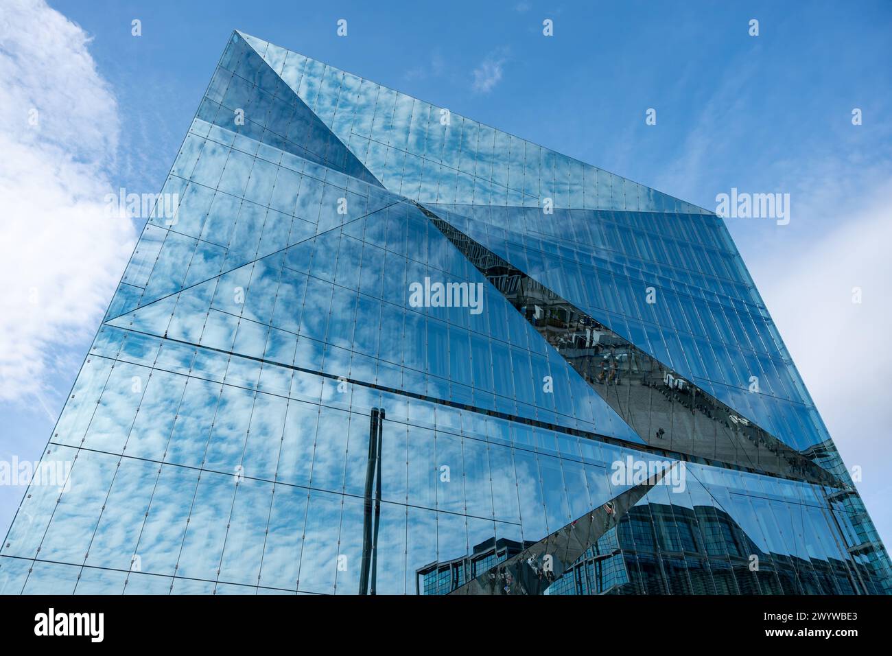 Glass building against the blue sky. Glass building facade close-up ...